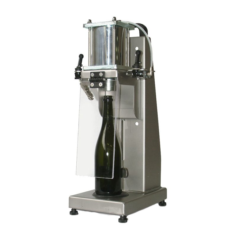 Pneumatic capping machine for bottles with crown caps